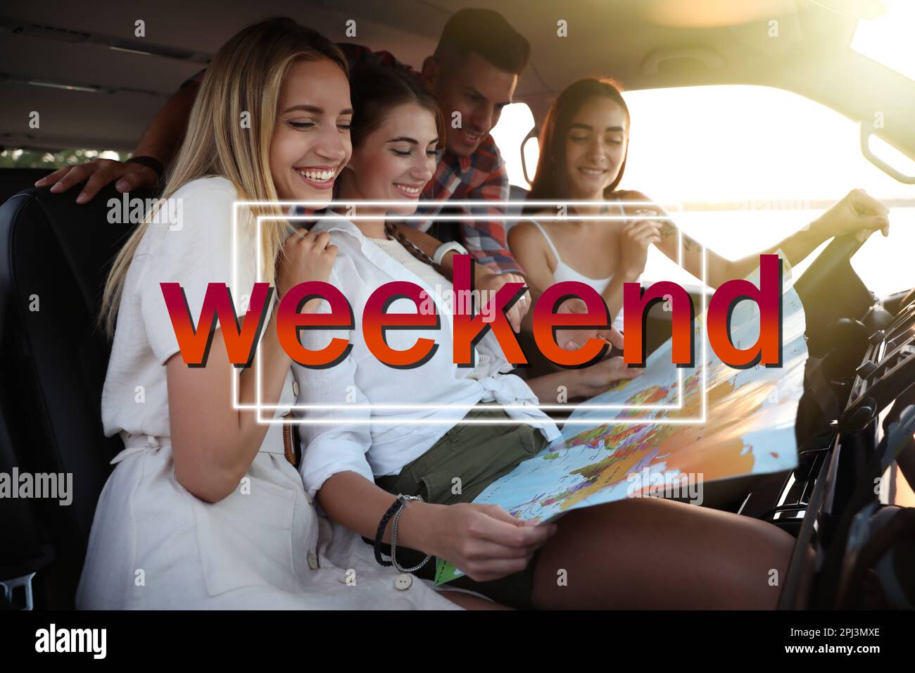 Hello Weekend. Happy friends with map in car on road trip Stock Photo ...