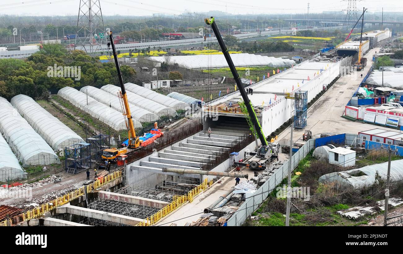 SHANGHAI, CHINA - MARCH 31, 2023 - Aerial photo workers are ...