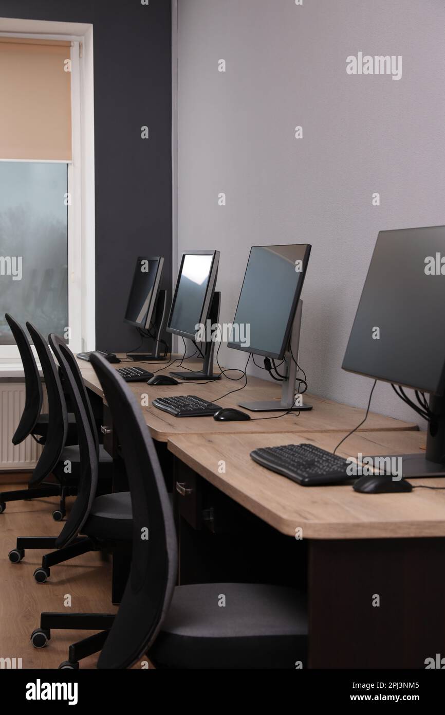 Many modern computers in open space office Stock Photo - Alamy