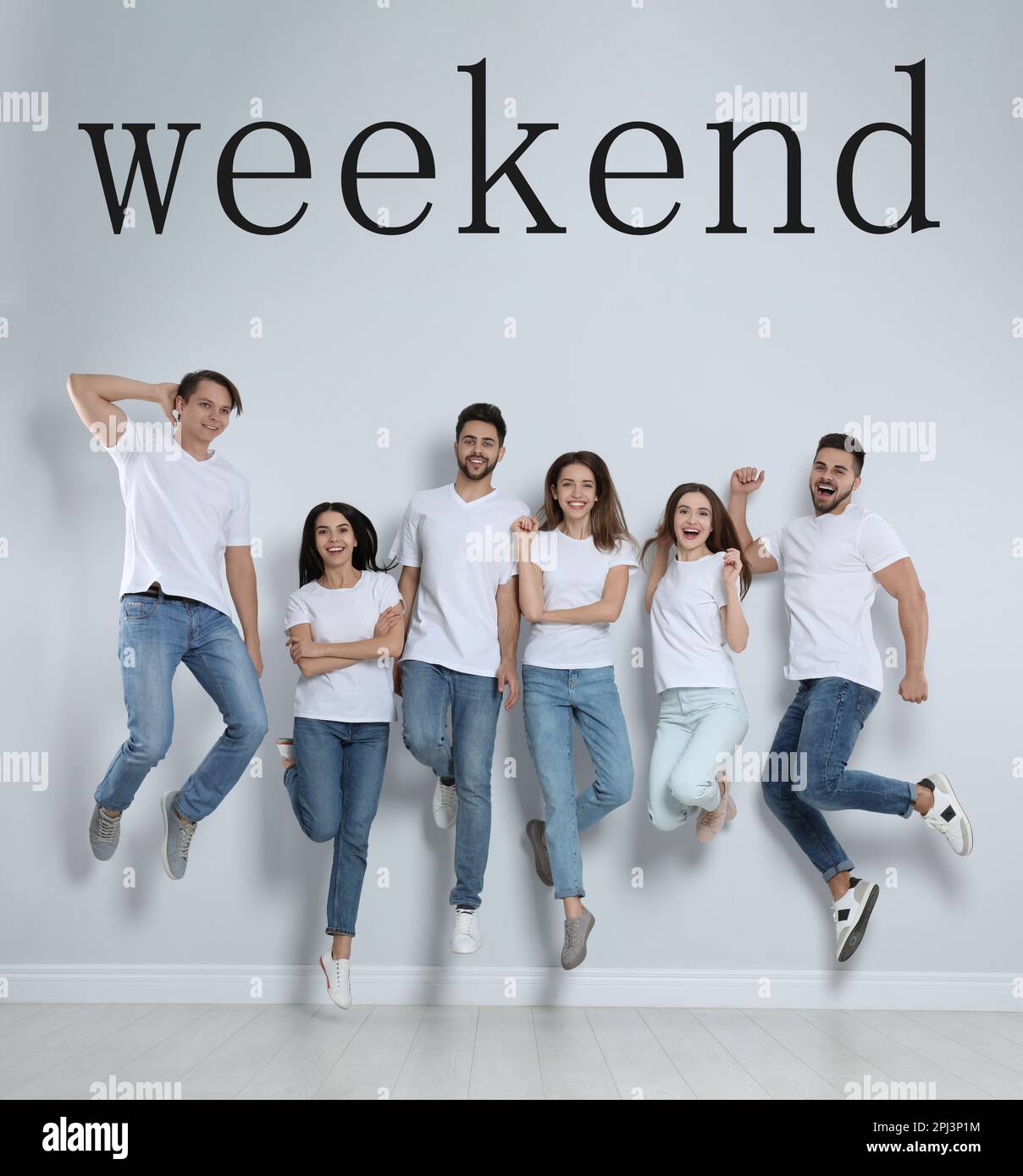 Hello Weekend. Group of friends jumping near light wall Stock Photo - Alamy