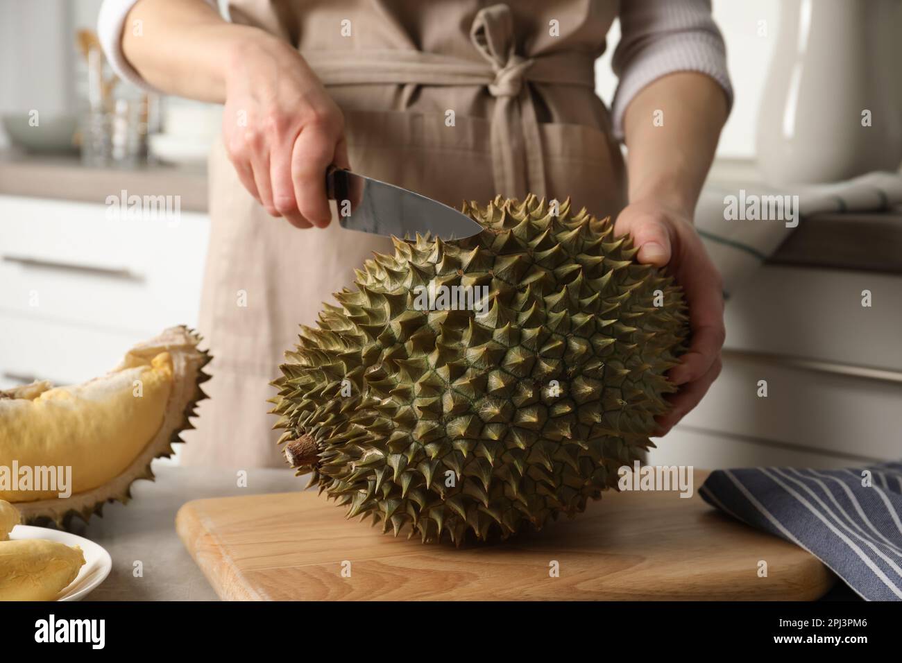 Woman cutting durian hi-res stock photography and images - Alamy