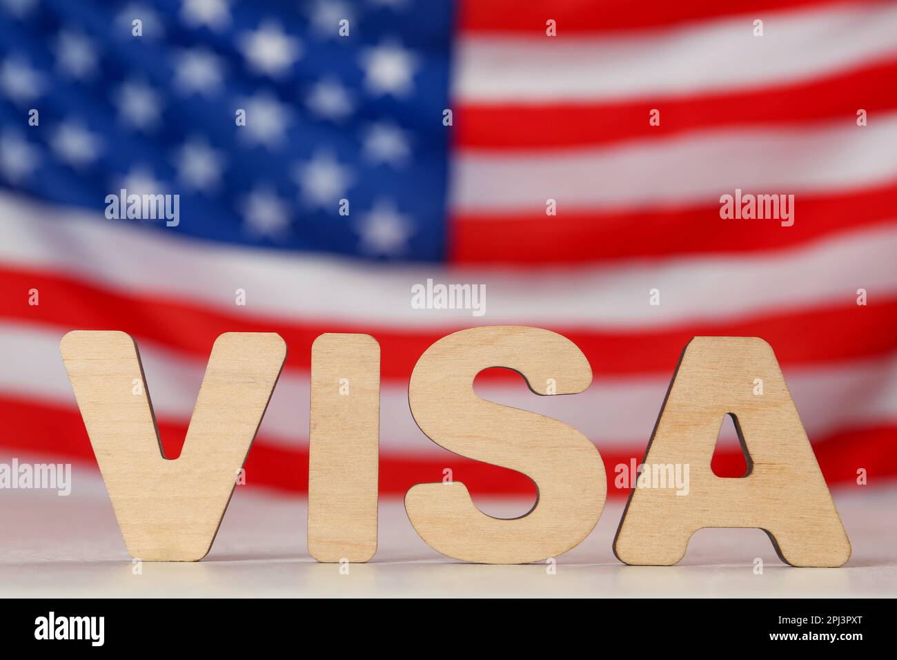 Word Visa made of wooden letters on light grey table against American ...