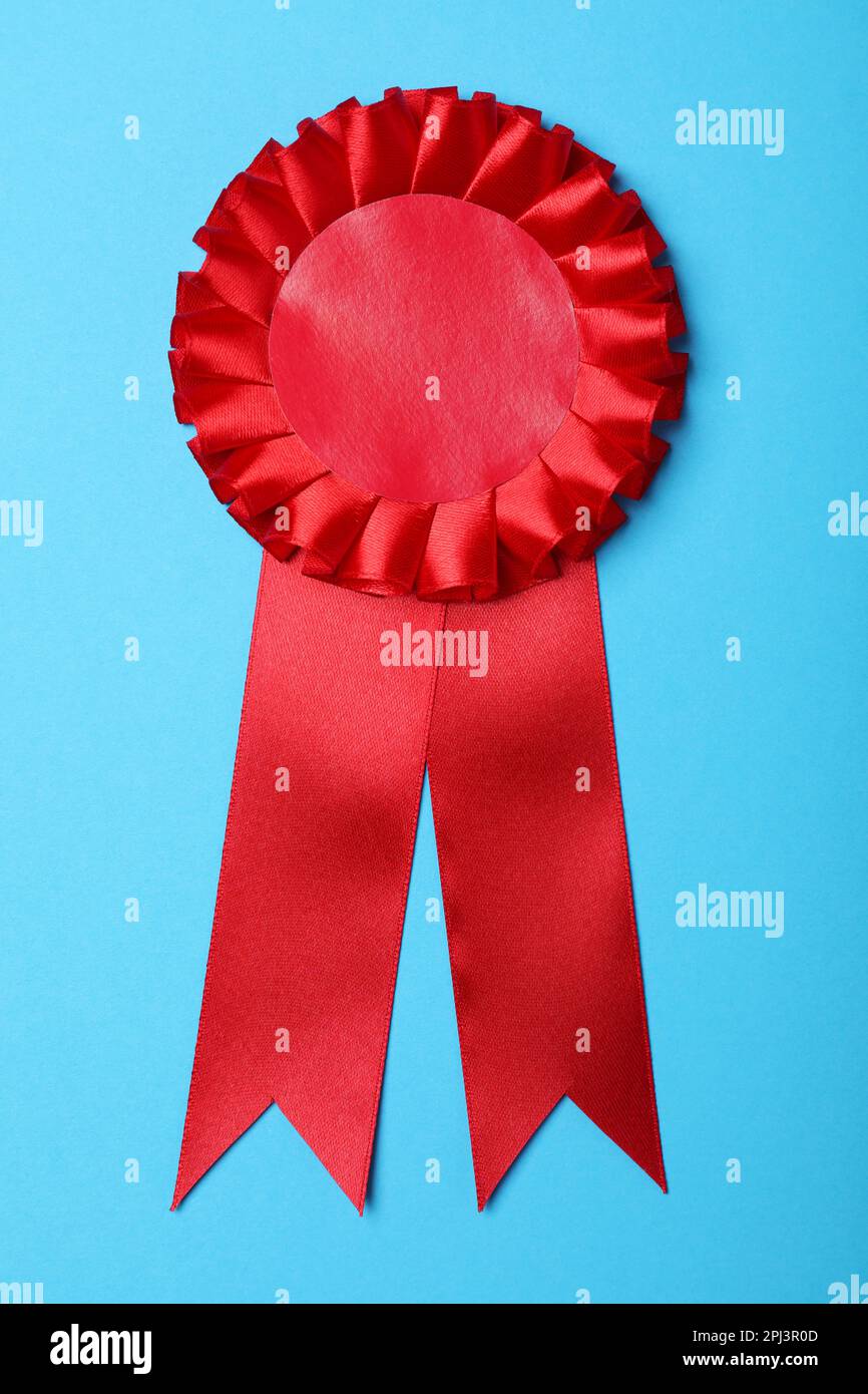 Red award ribbon on turquoise background, top view Stock Photo - Alamy