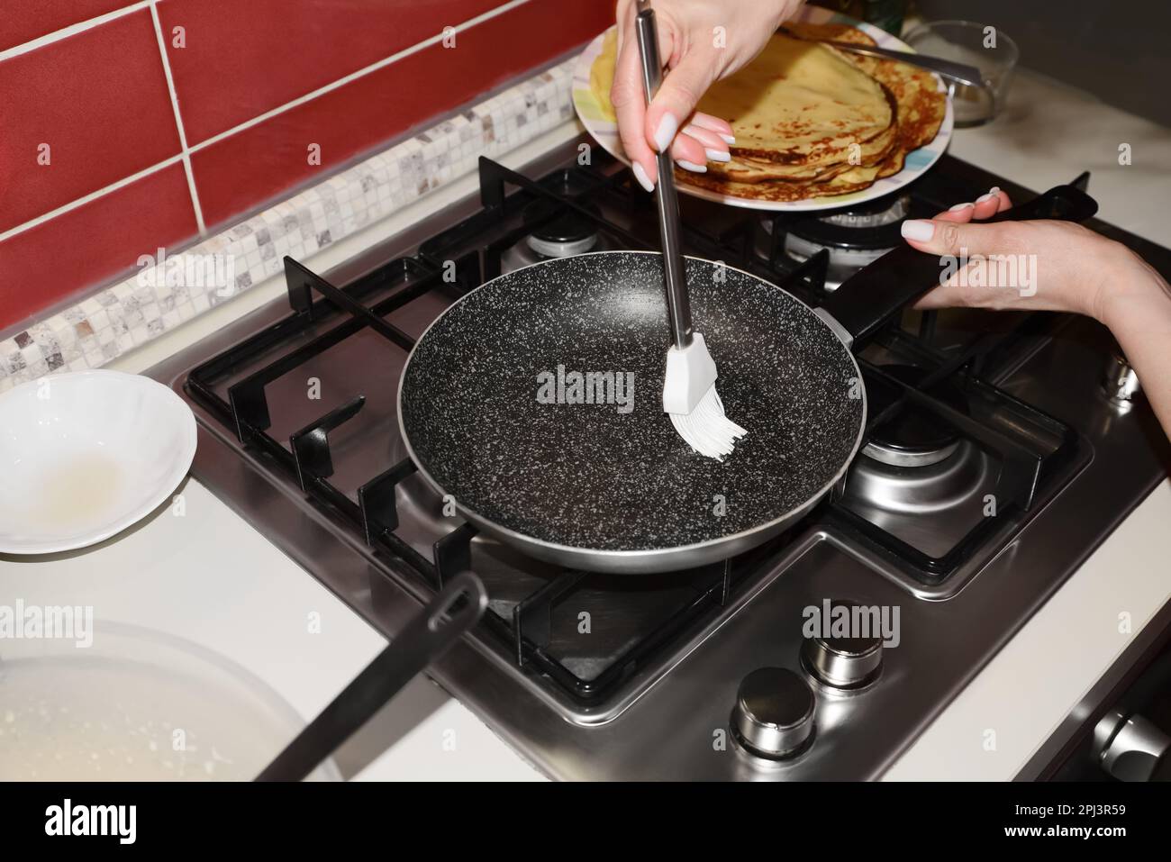 Woman frying pan butter hi-res stock photography and images - Alamy