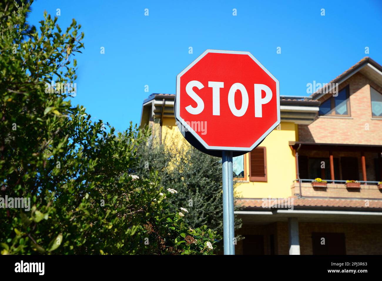 Car near stop sign hi-res stock photography and images - Alamy