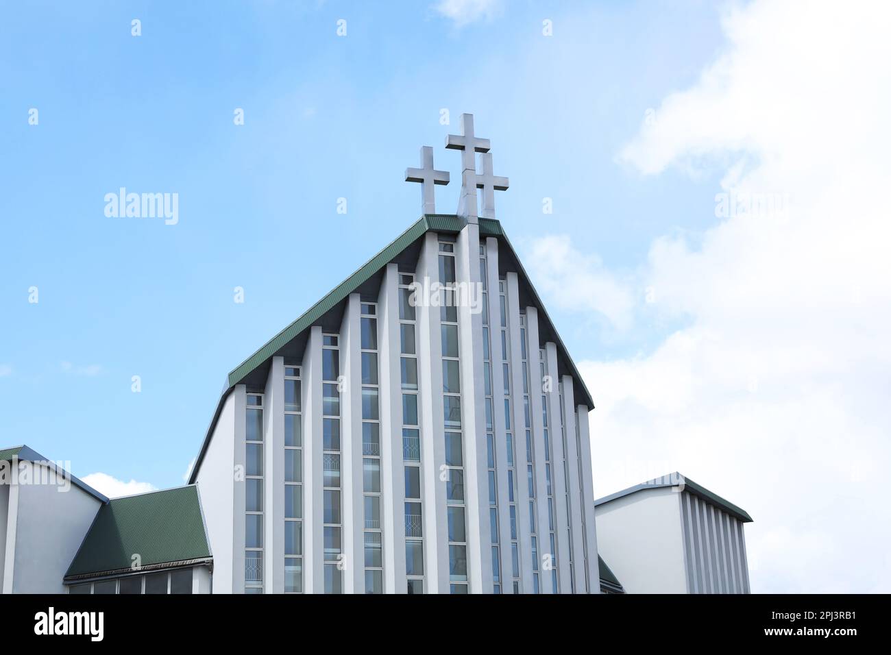 Exterior of modern church against blue sky with clouds Stock Photo - Alamy