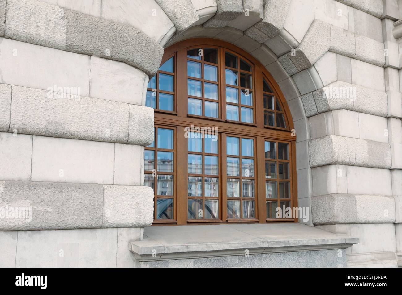 View of beautiful arched window in building outdoors Stock Photo - Alamy