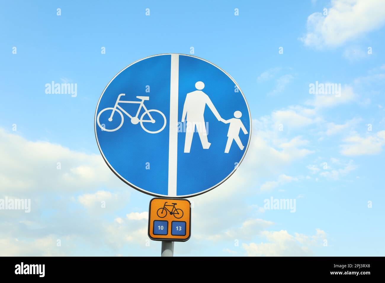 Traffic sign Compulsory Track For Pedestrians and Bicycles against blue ...