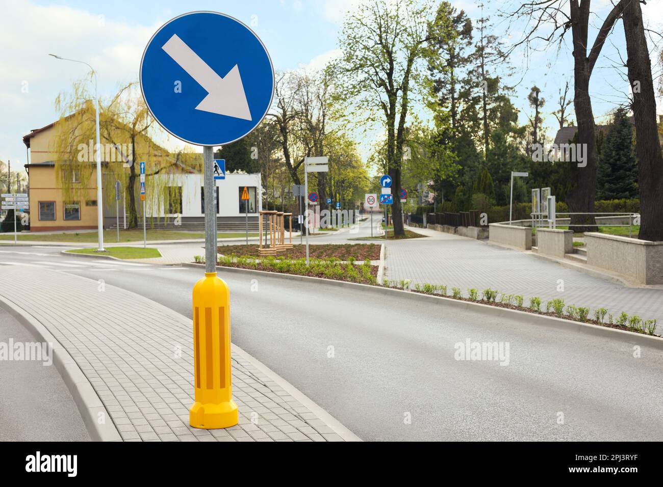 Traffic sign Keep Right on city street, space for text Stock Photo - Alamy