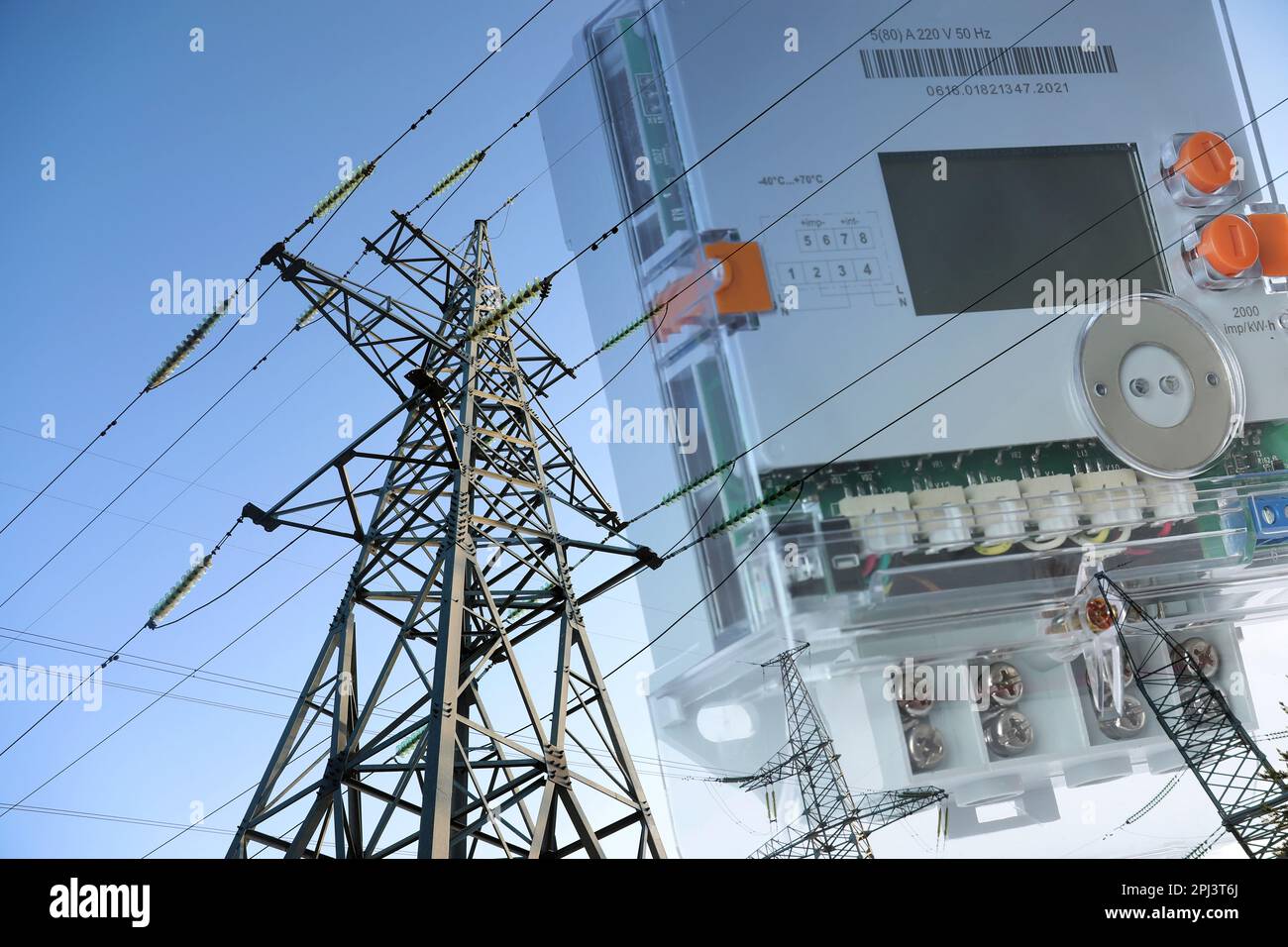 Double exposure of electricity meter and high voltage tower with ...