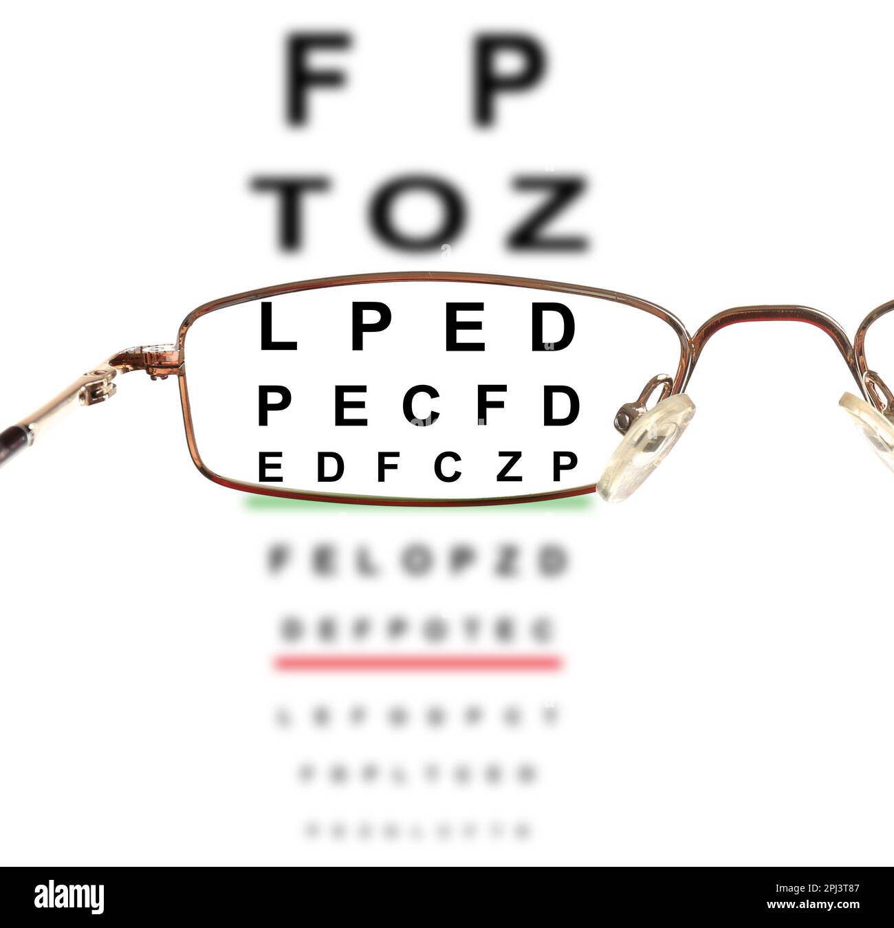 View through glasses on eye chart, white background Stock Photo - Alamy