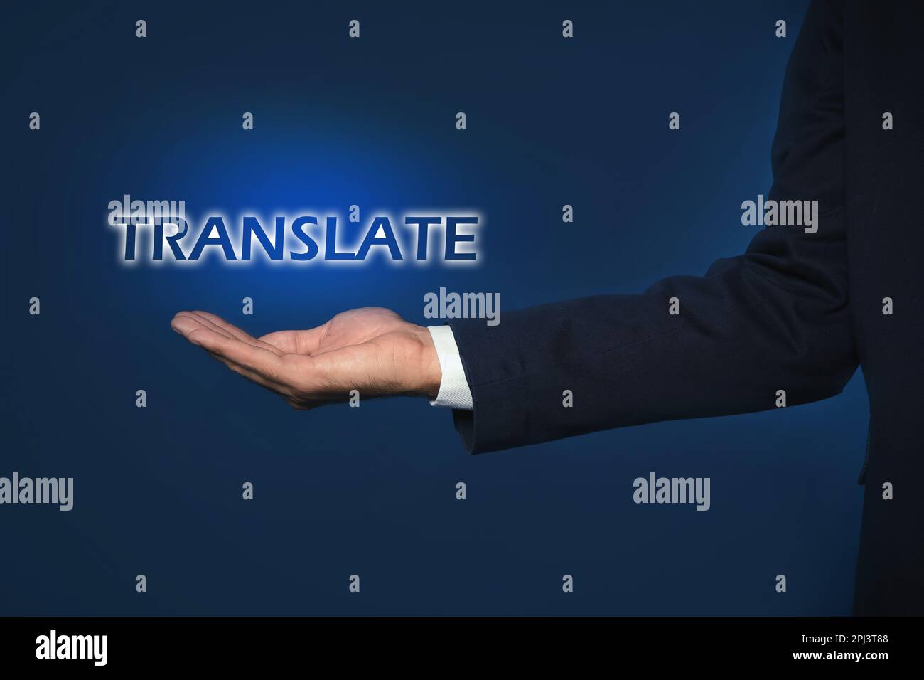 Man showing virtual model of word TRANSLATE against dark blue ...