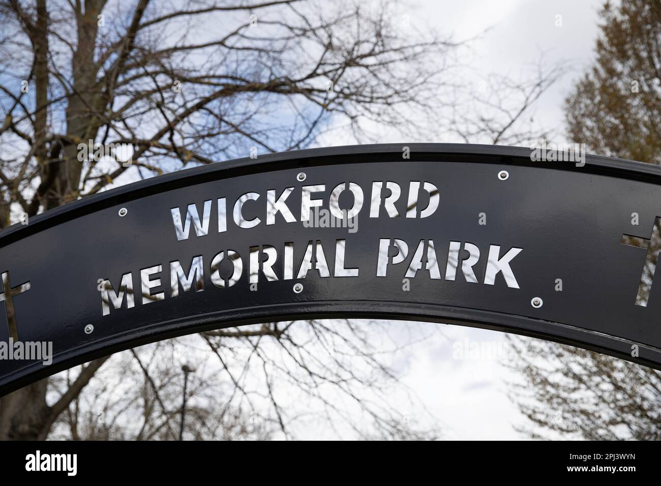 Stencil lettering on a metal sign marking the entrance to Wickford ...