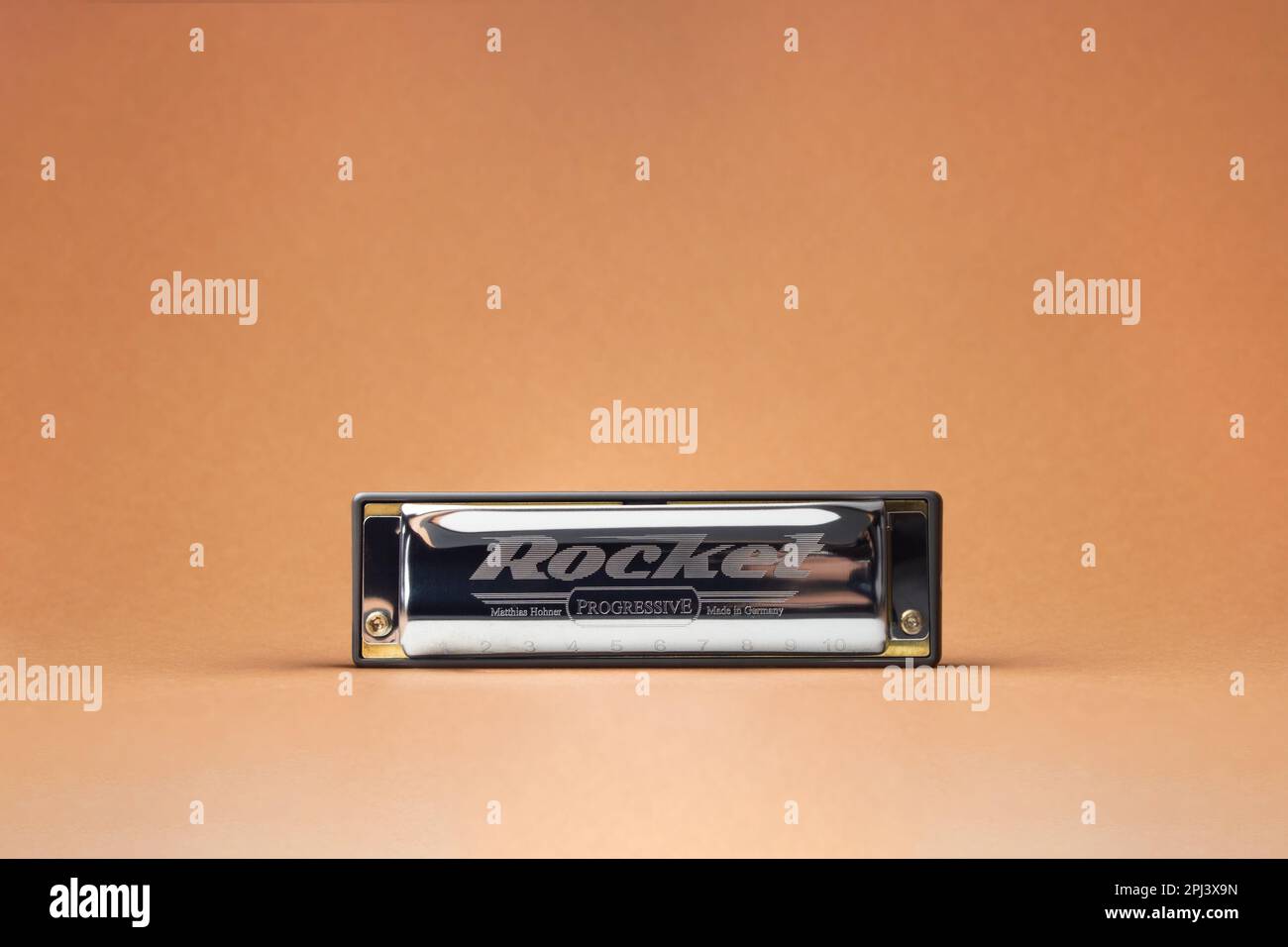 The Hohner Rocket professional diatonic harmonica stands at the ...