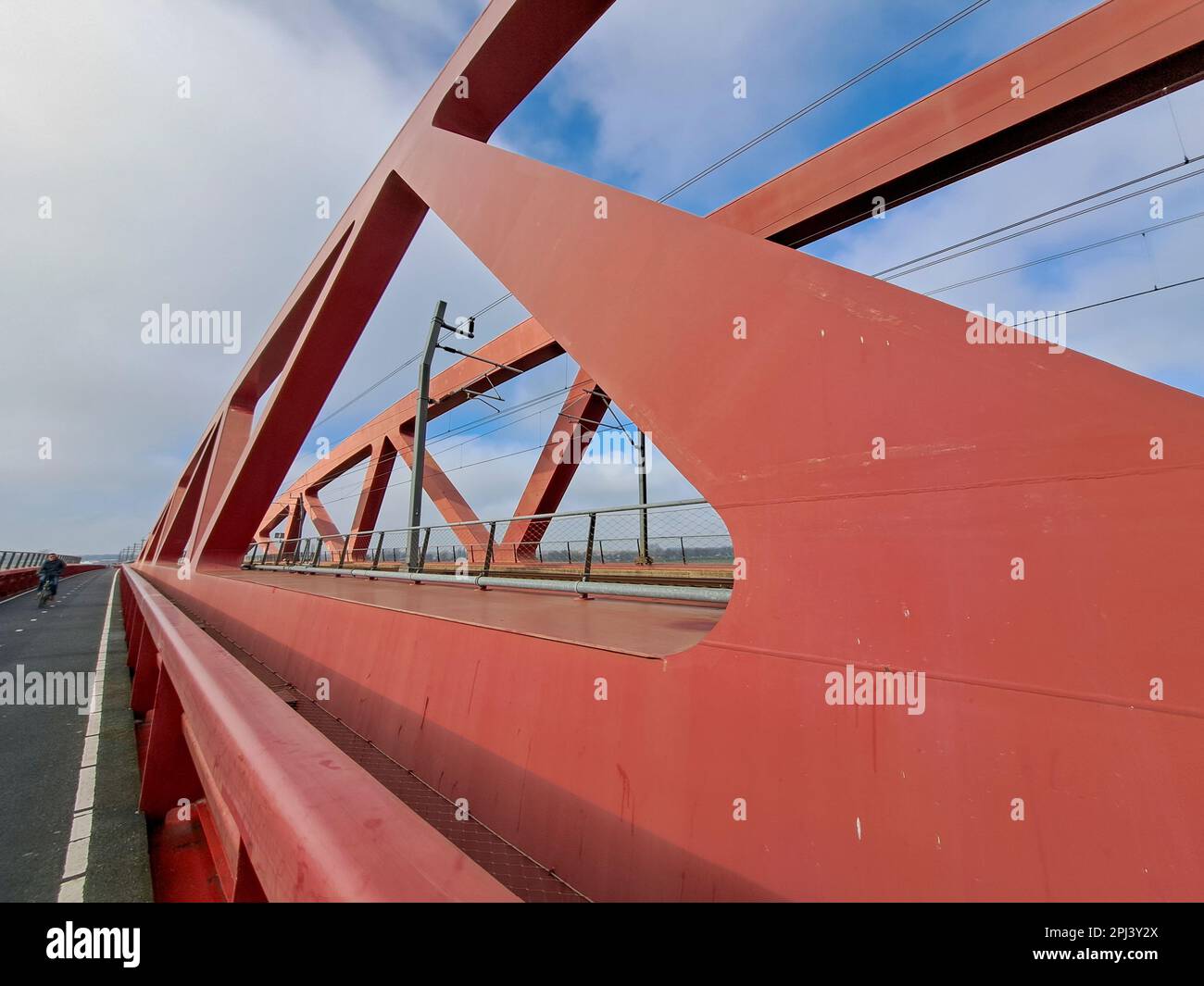 Red steel bridge called Hanzeboog over the river IJssel between Hattem ...