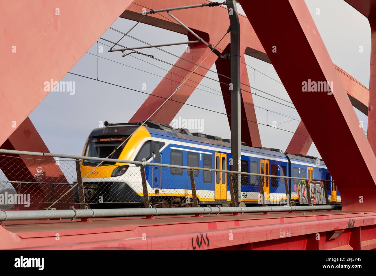 Red steel bridge called Hanzeboog over the river IJssel between Hattem ...