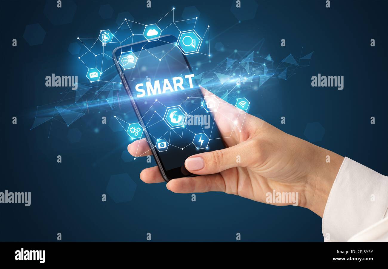 Hand using smartphone with technology concept Stock Photo - Alamy