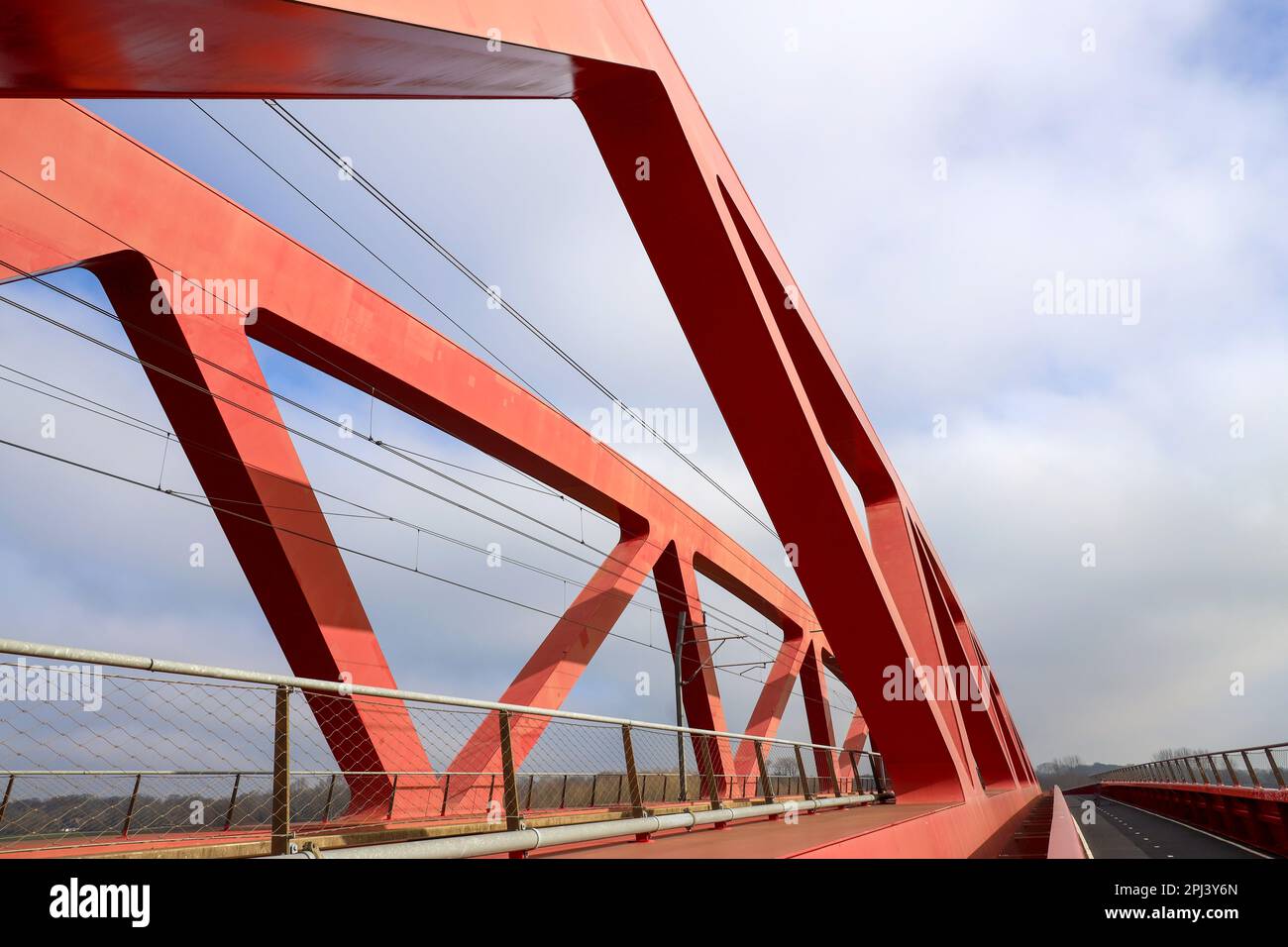 Red steel bridge called Hanzeboog over the river IJssel between Hattem ...