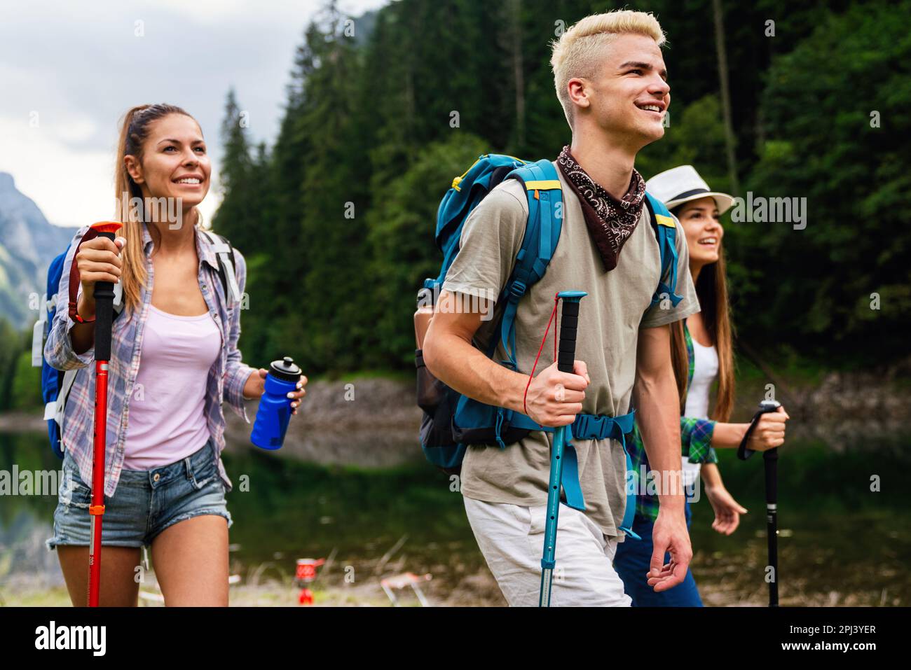 Group of happy hiker friends trekking as part of healthy lifestyle ...