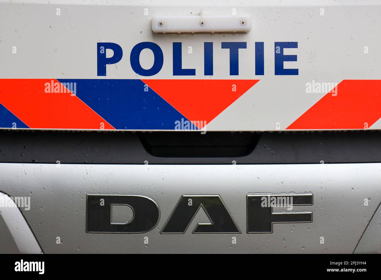 Logo and striping in front of dutch police (politie) car in the ...