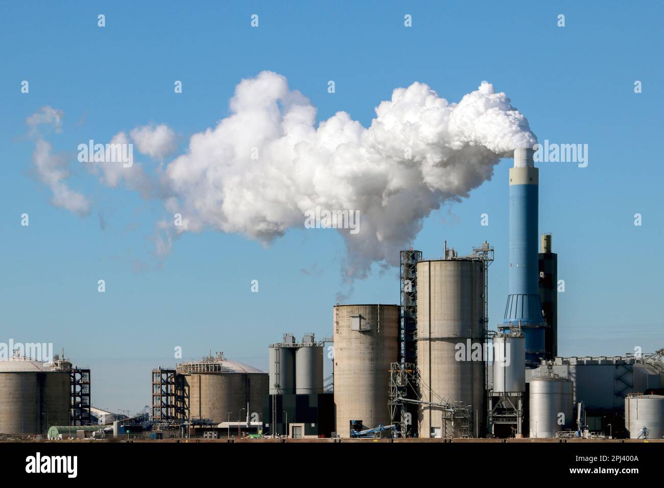 Steam coming out of the chimney at power plant in Rotterdam Maasvlakte ...