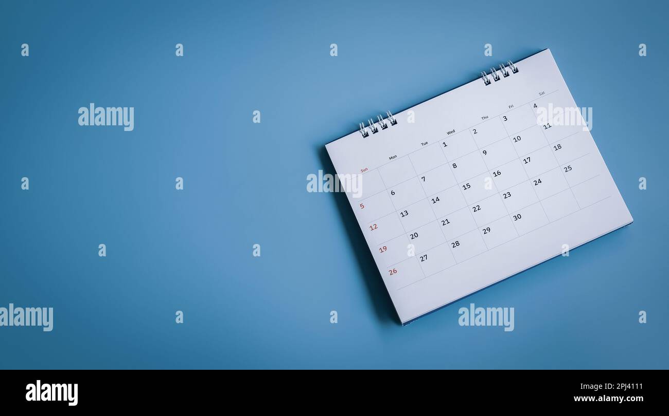 White calendar on blue background, planning and schedule concept Stock ...