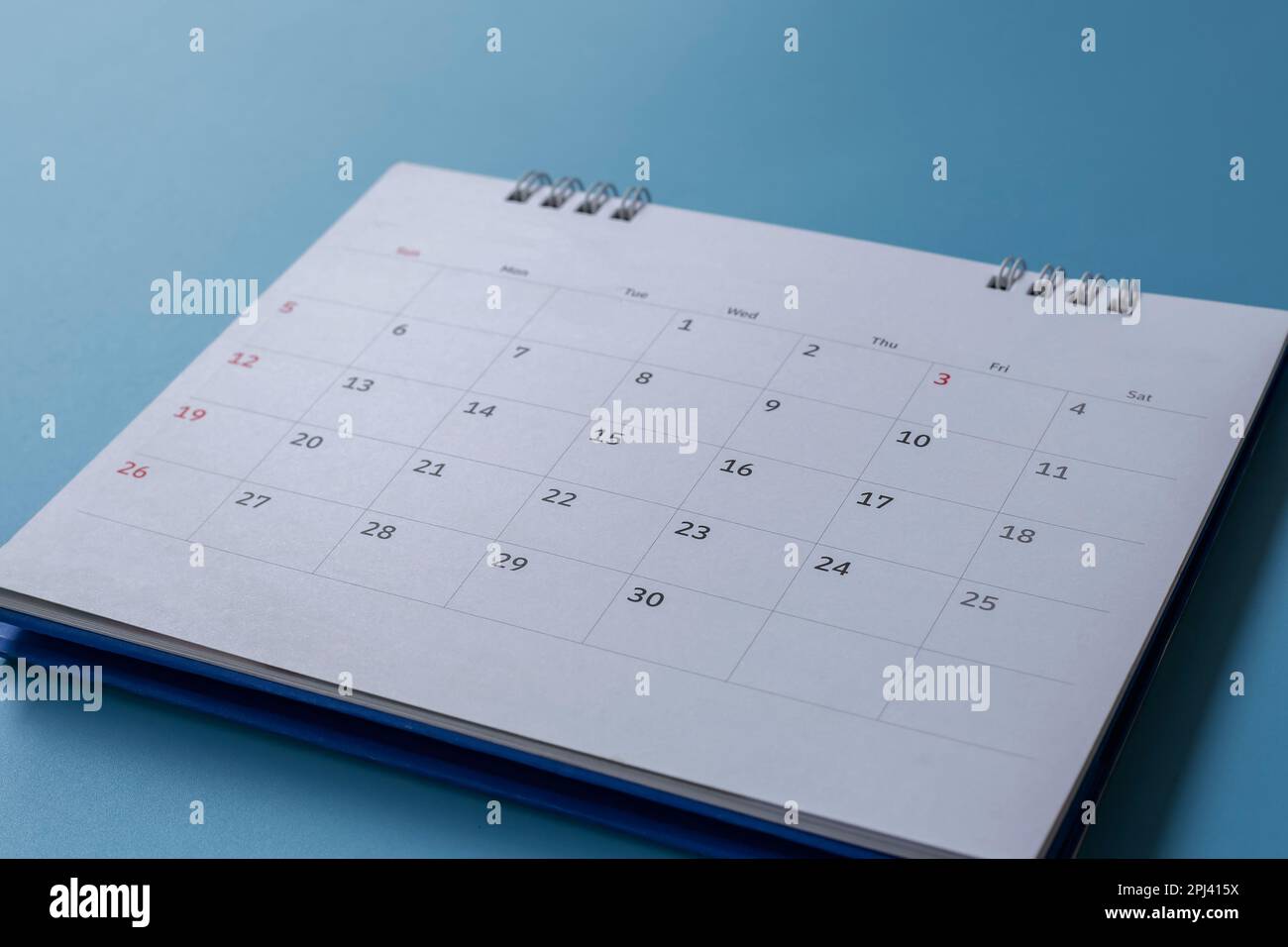 White calendar on blue background, planning and schedule concept Stock ...