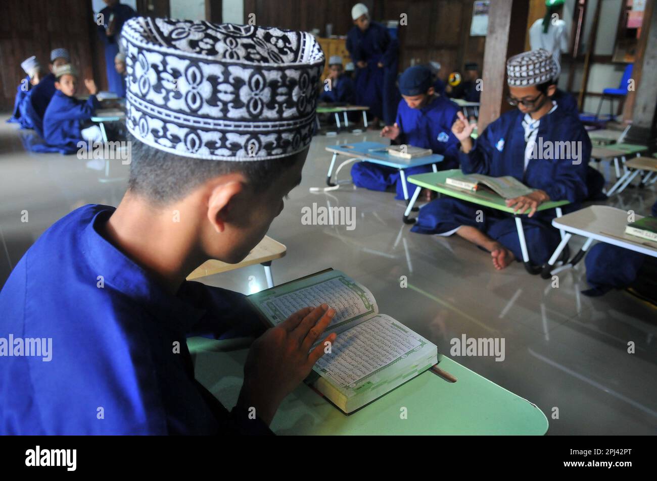 Memorizing quran hi-res stock photography and images - Alamy