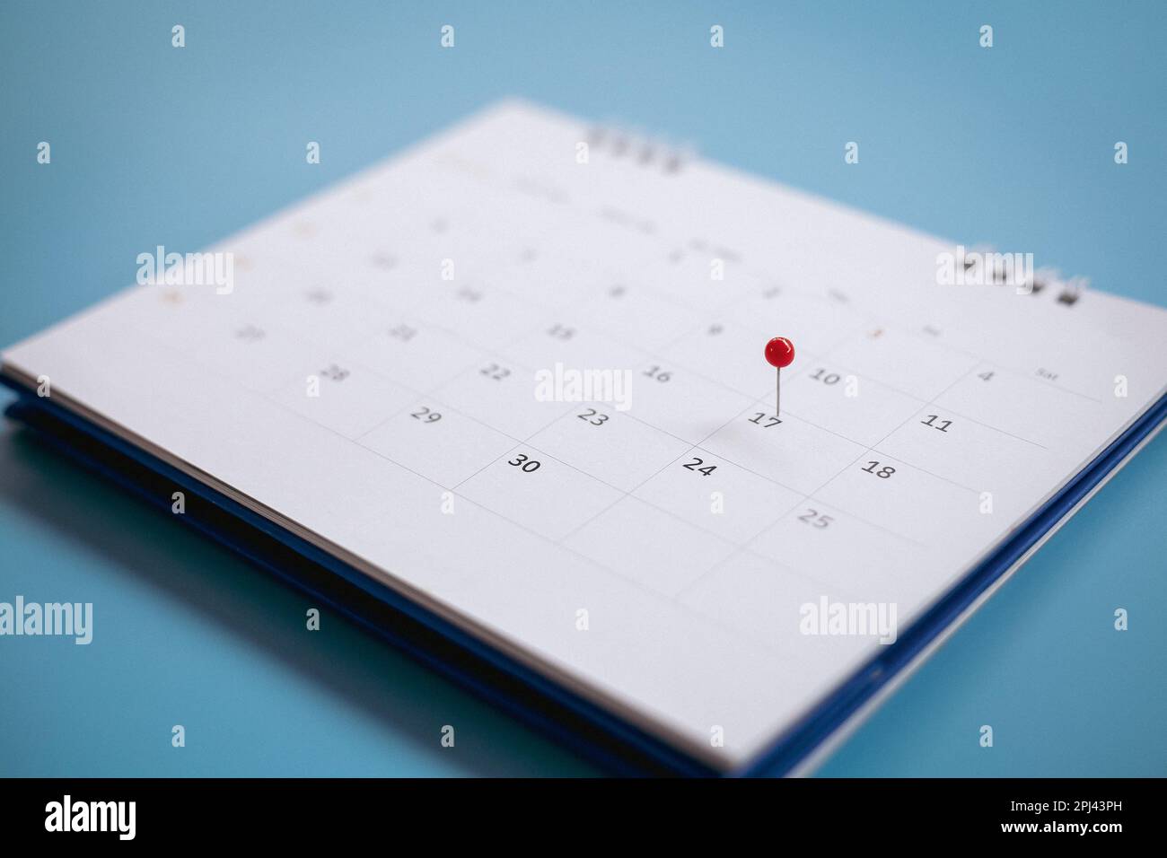 White calendar on blue background, planning and schedule concept Stock ...