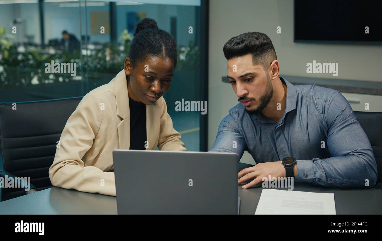 Diverse Indian Arabian man and African American woman colleagues ...