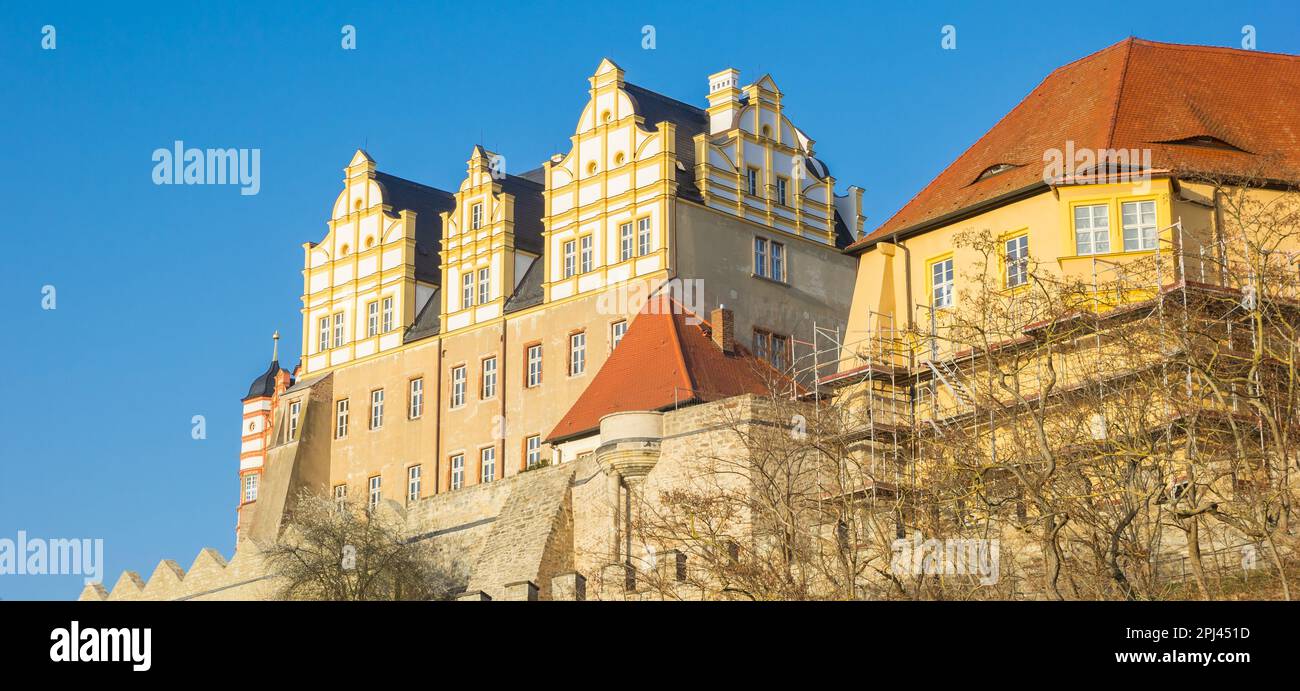 Panorama of the colorful historic castle on top of the hill in Bernburg ...