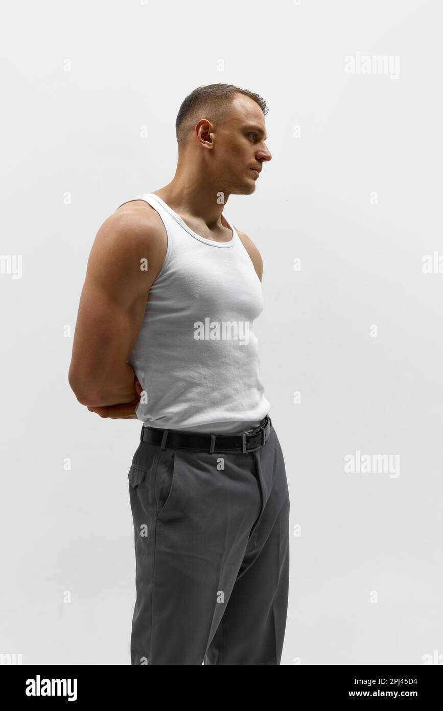 Shot of muscular male fashion model posing isolated over white studio ...