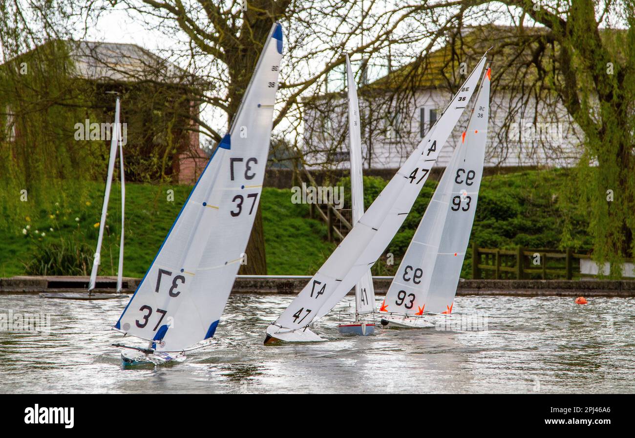 Model sailing yachts racing on a dedicated pond in Woodbridge Suffolk ...