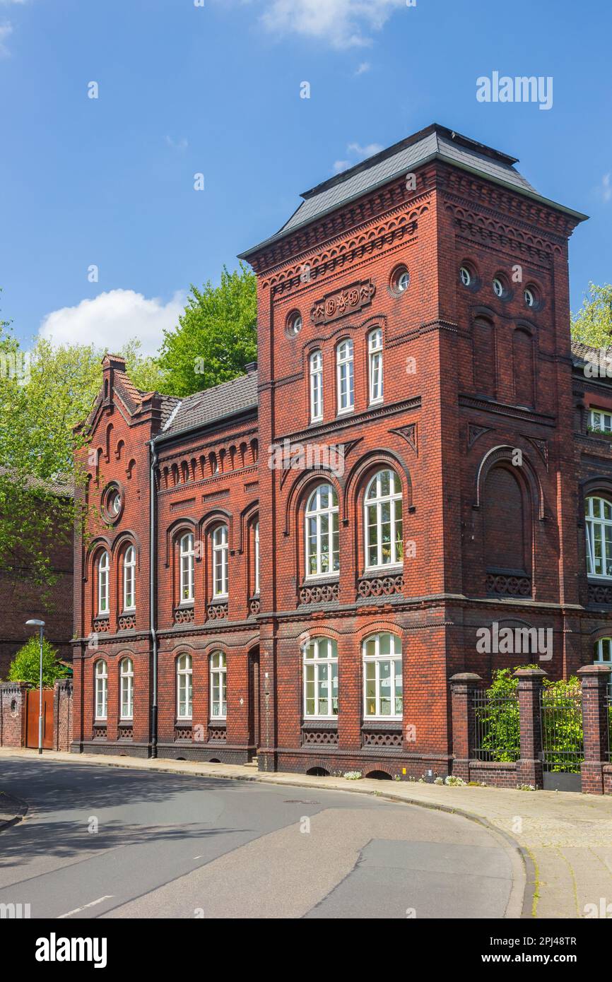 Road leading to a historic red brick house in Essen, Germany Stock ...