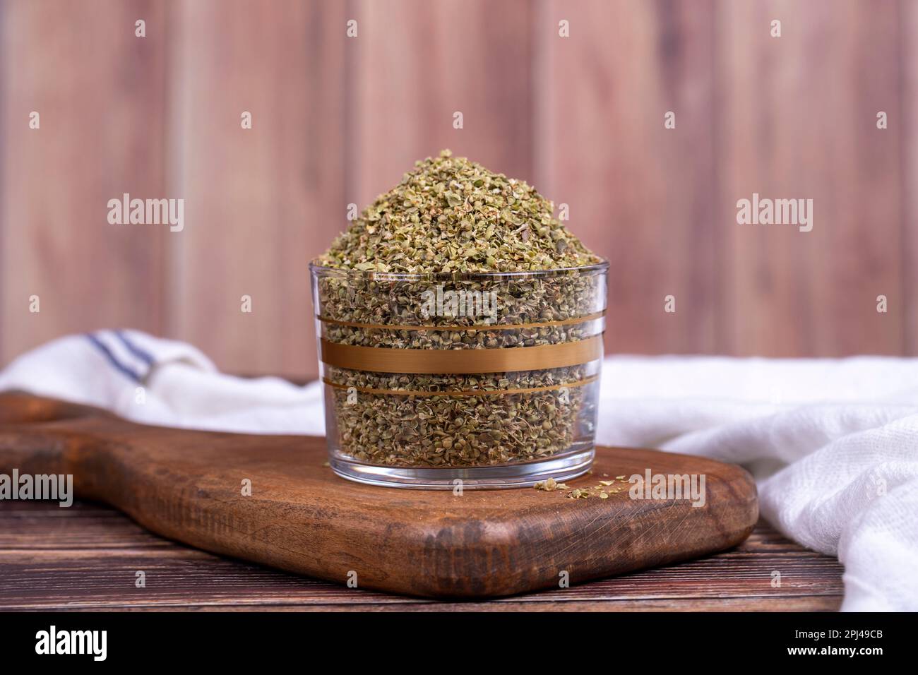 Thyme spice. Dried Thyme leaf in glass bowl on wood floor. Spice ...