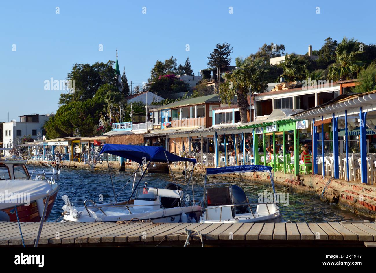 Turkey, Bodrum Peninsula, Gümüslük: colourful restaurants crowding the ...