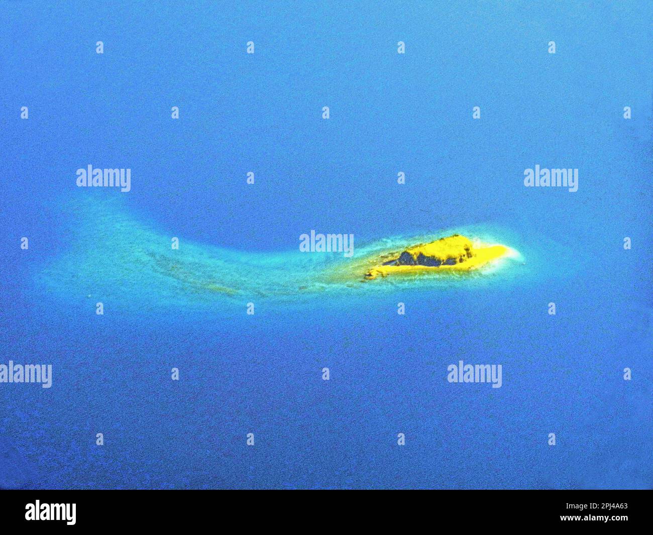 Philippine Archipelago: aerial view of a reef with a tiny, rocky ...