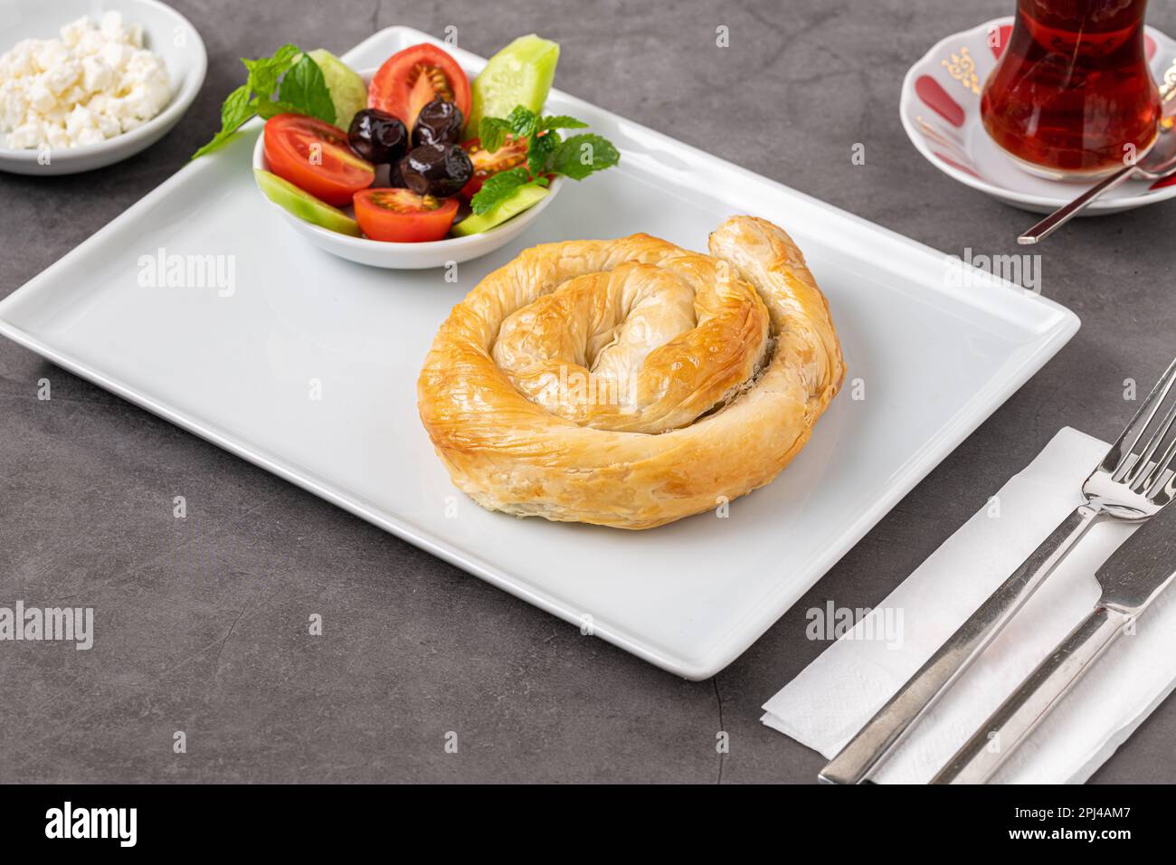 Traditional Turkish pastry made with spinach and cheese wrapped in ...