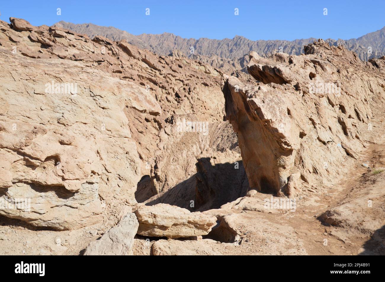 People's Republic of China, Xinjiang Province: rugged, barren scenery ...