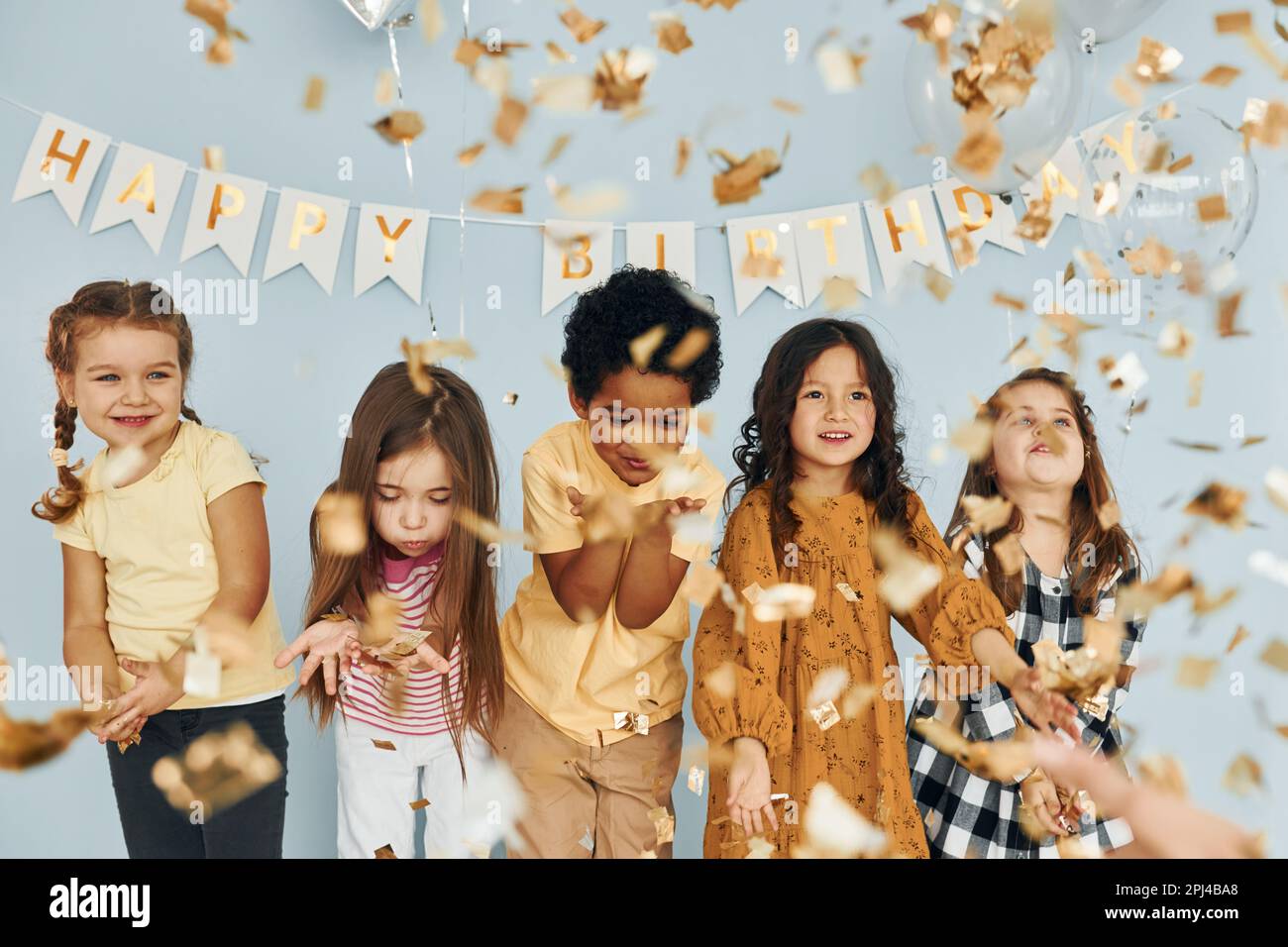 Children on celebrating birthday party indoors have fun together Stock ...