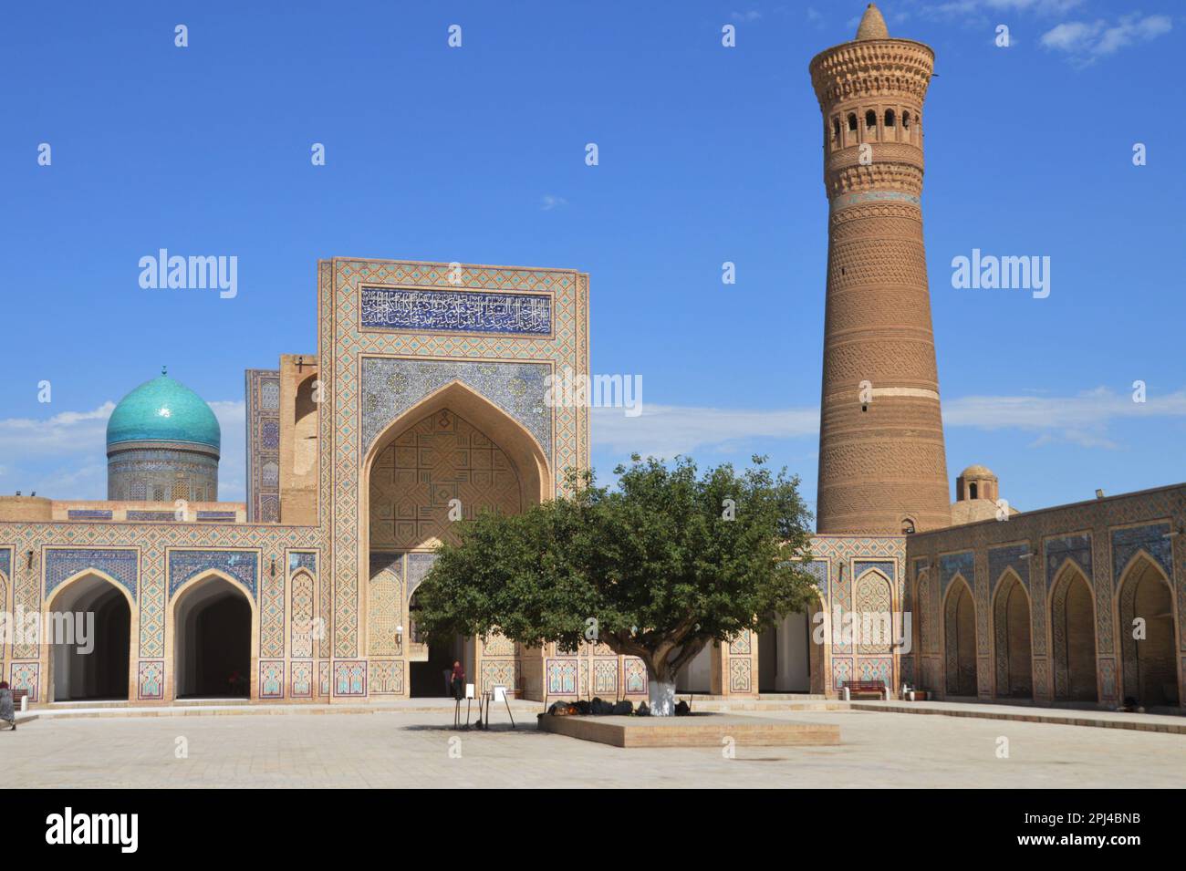 Uzbekistan, Bukhara: facade and iwan of the madrasa in the courtyard of ...