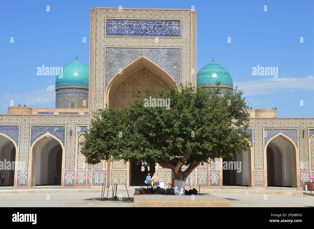 Uzbekistan, Bukhara: facade and iwan of the madrasa in the courtyard of ...