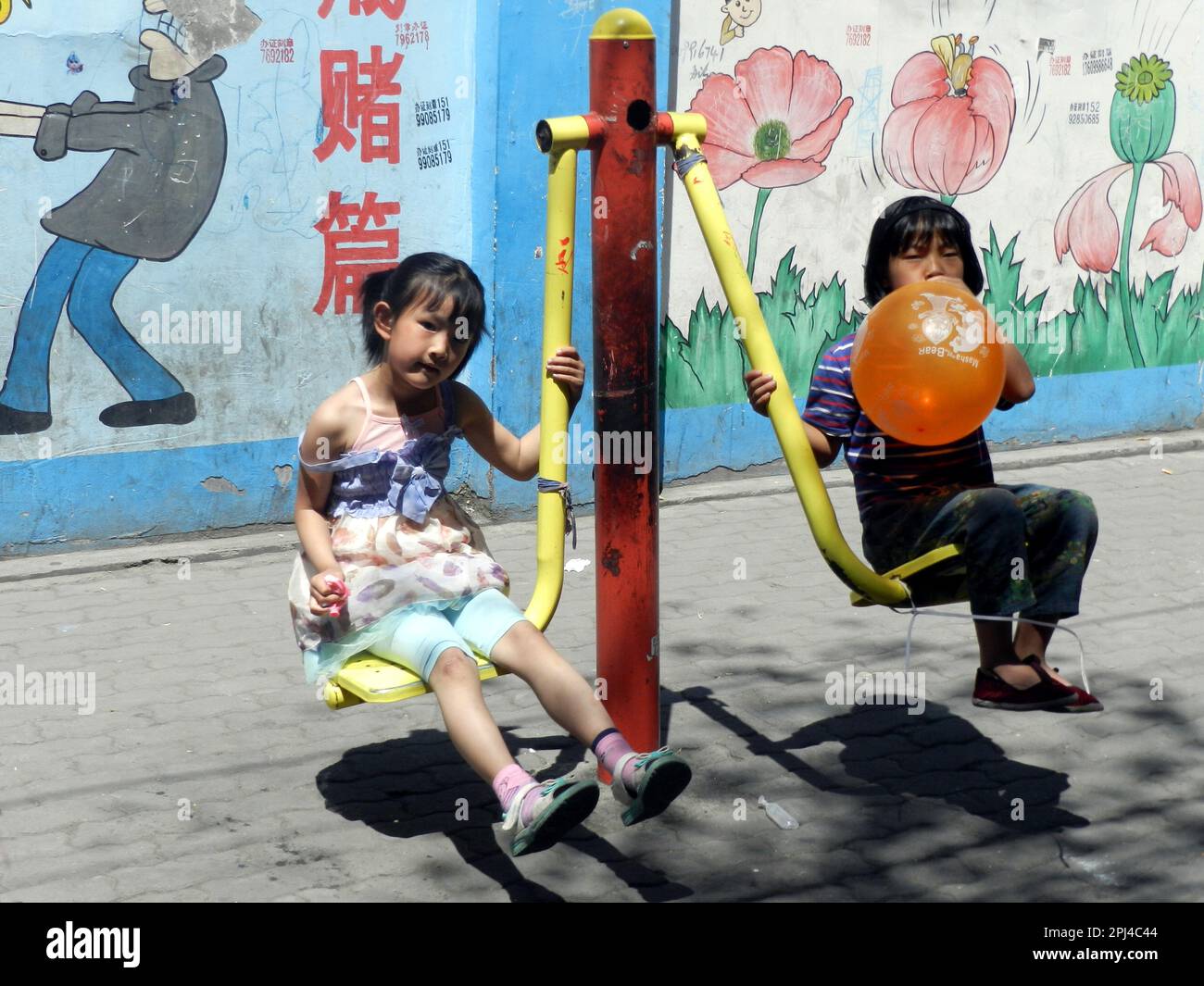 People's Republic of China, Xinjiang Province, Urumqi: children playing ...