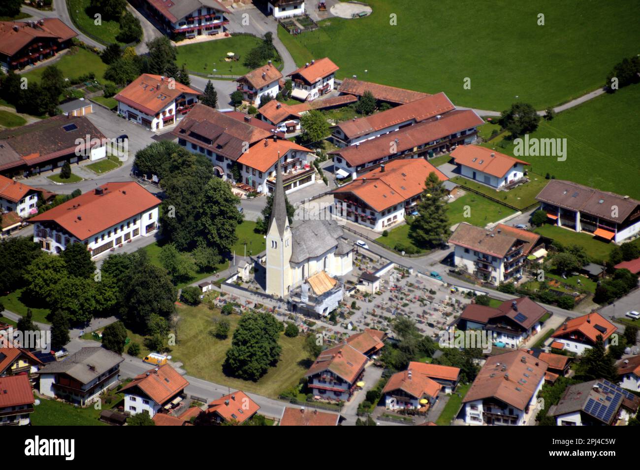 Germany, Upper Bavaria, Bayrischzell: view of the village church from ...