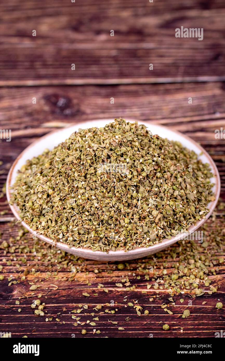Thyme spice. Dried Thyme leaf in bowl on wood background. Spice concept ...
