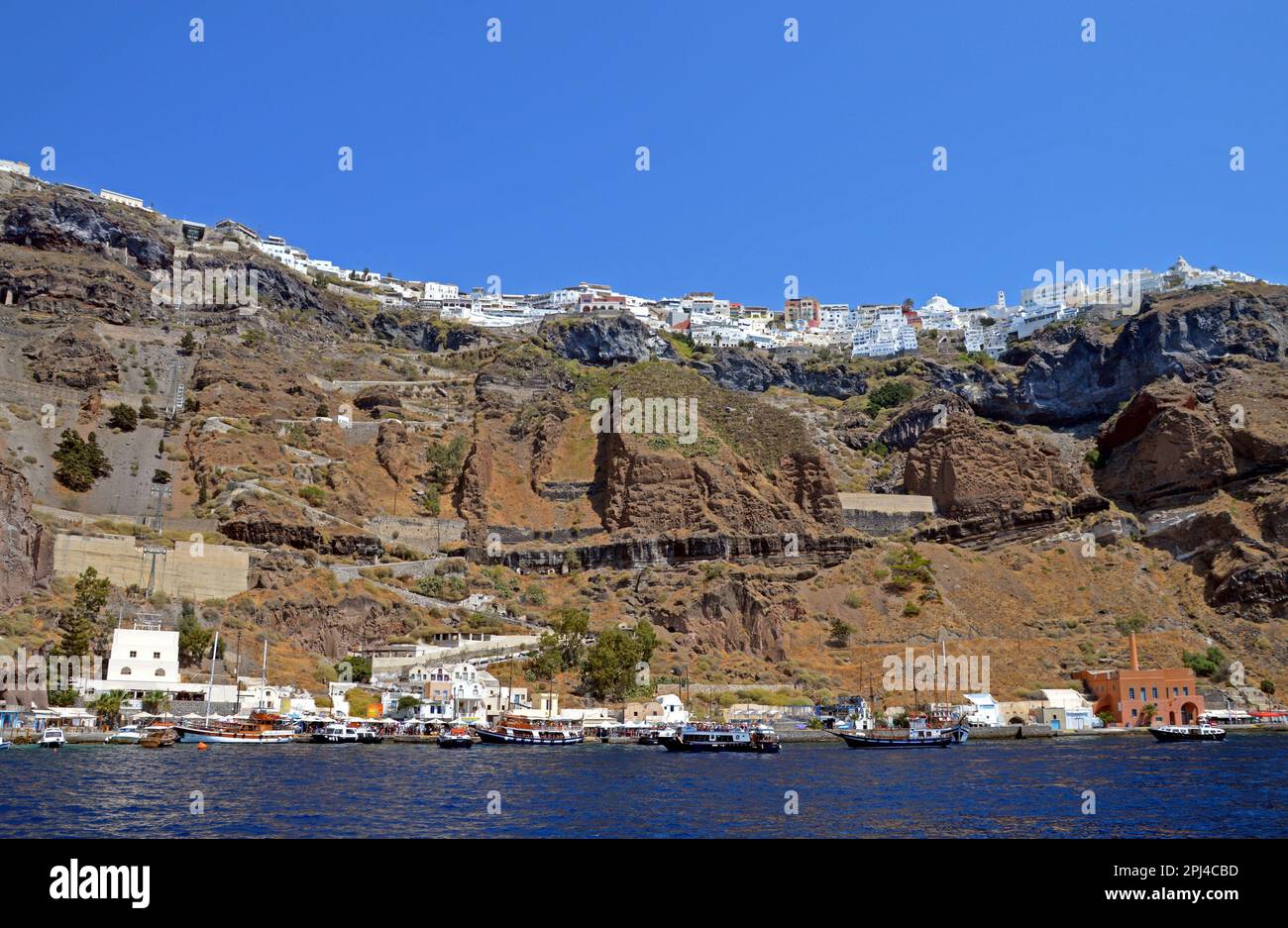 Greece, Island of Santorini: Fira, the capital, with port, Athinios ...