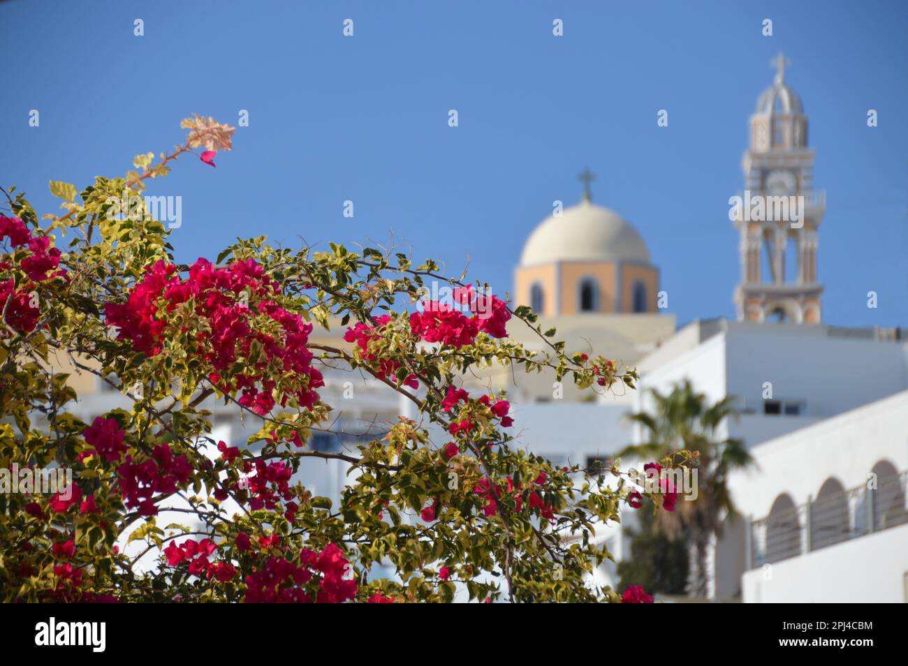Greece, Island of Santorini: the clock tower and dome of the Catholic ...