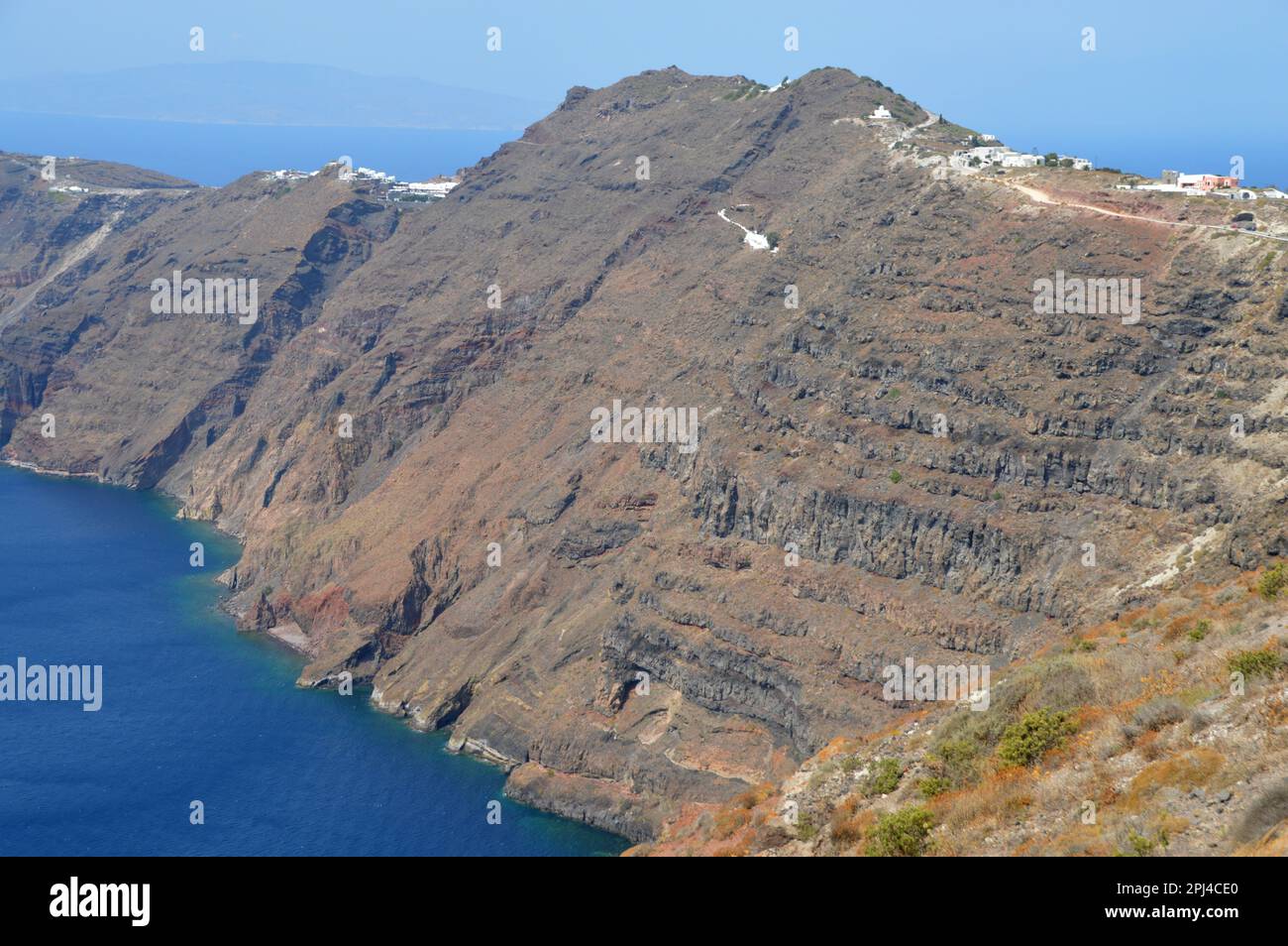 Greece, Island of Santorini: view of the steep lip of the ex-volcano at ...