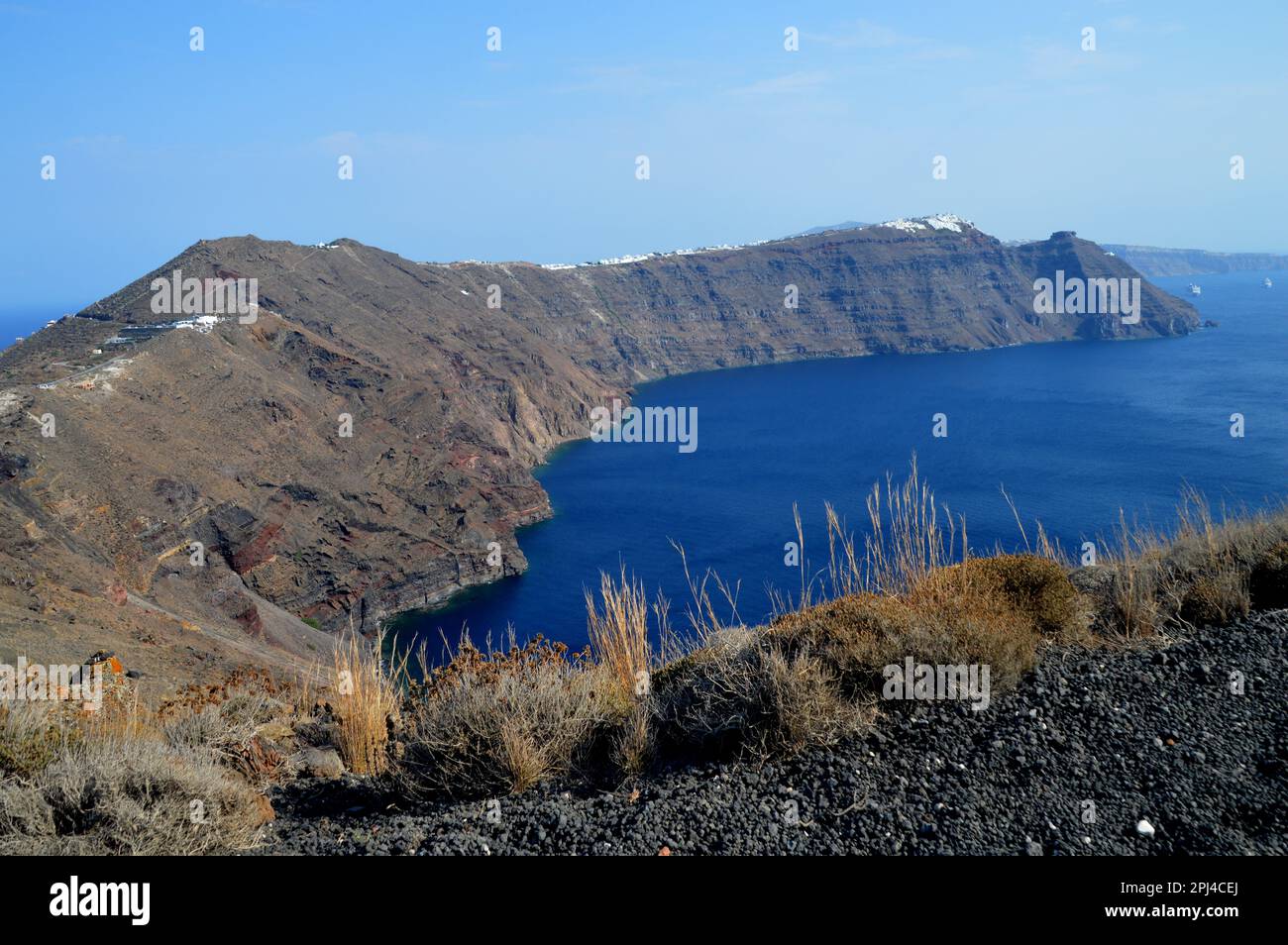 Greece, Island of Santorini: view of Oia on the end of its peninsula ...
