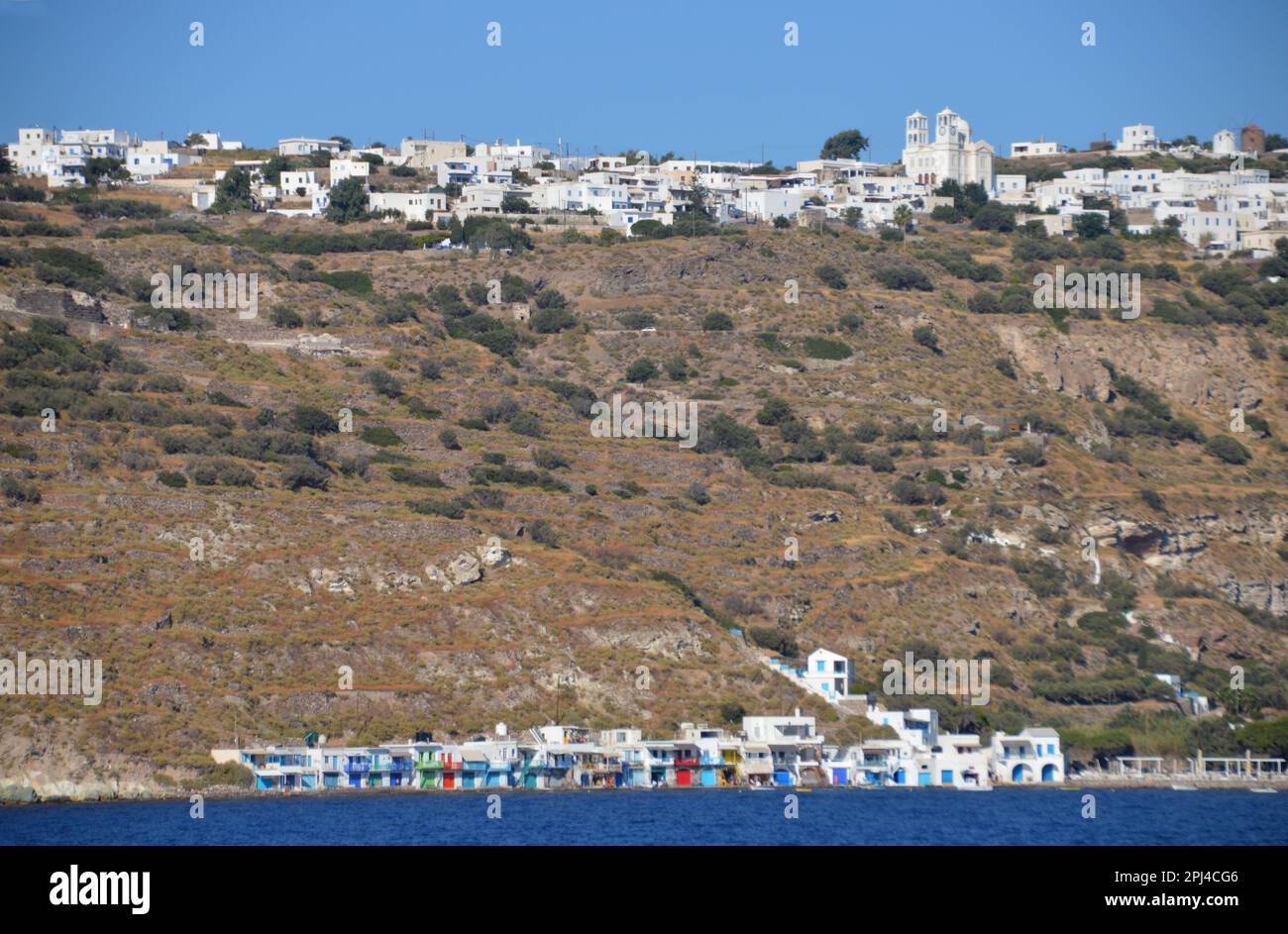 Greece, Island of Milos: the town of Tripiti, spread along the ridge ...